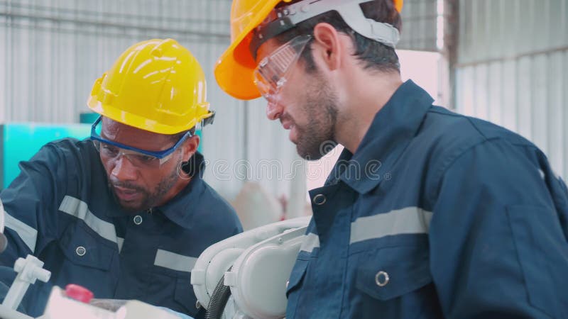 Two Young Engineer Man Talking and Explaining about Robot Arms ...