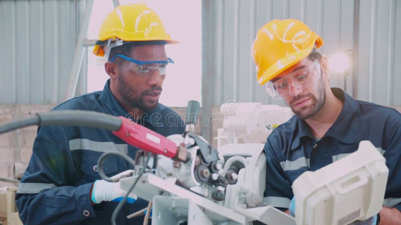 Two Young Engineer Man Talking and Explaining about Robot Arms ...