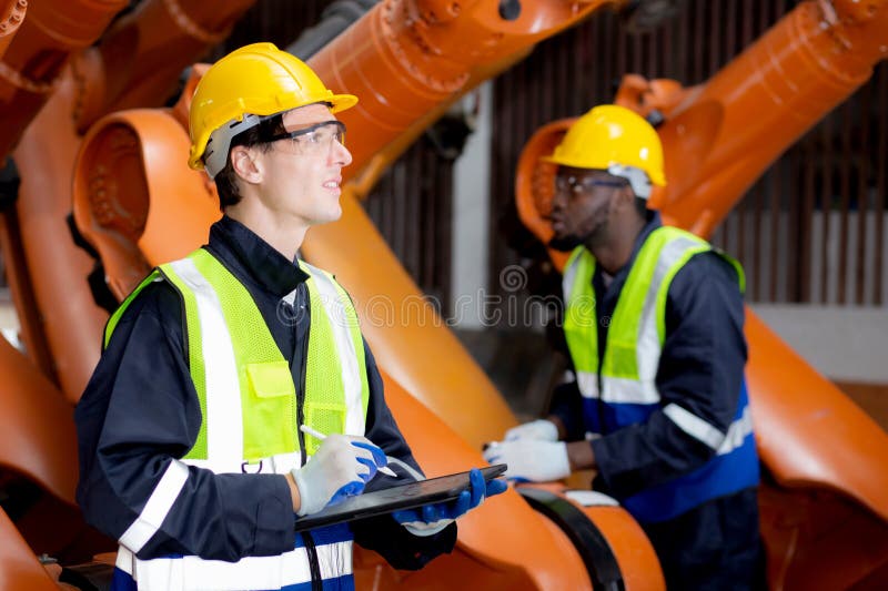 Two Young Engineer Man Checking and Maintenance Machine Robot Arms ...