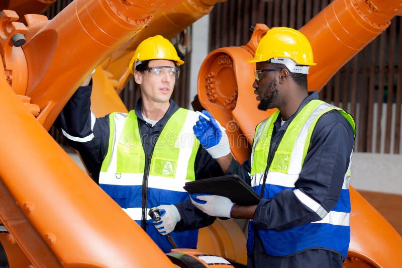 Two Young Engineer Man Meeting and Explaining about Robot Arms ...