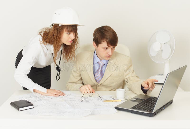 Two Young Engineers Work Over Project on Laptop Stock Image - Image of ...
