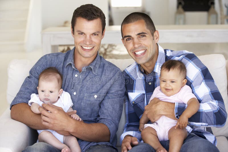 Two Young Fathers on Sofa at Home Stock Image - Image of beautiful ...