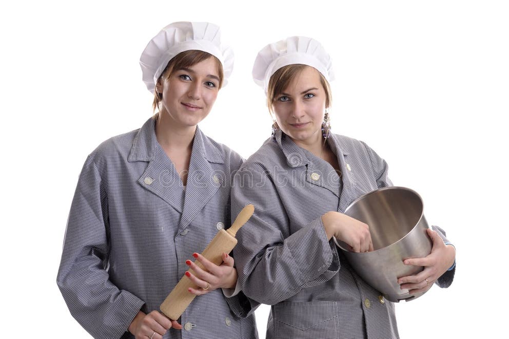 Two young female cooks stock photo. Image of looking - 17741626