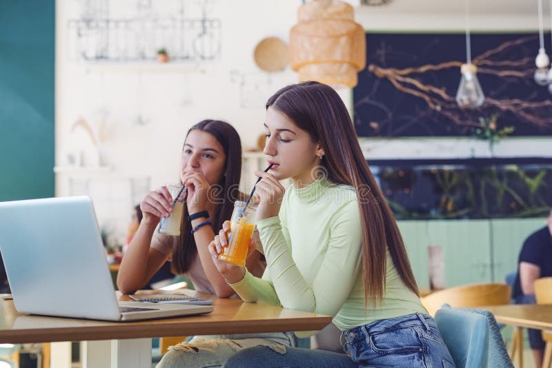 Two Young Friends Drinking Fresh Fruit Juice Stock Image - Image of ...