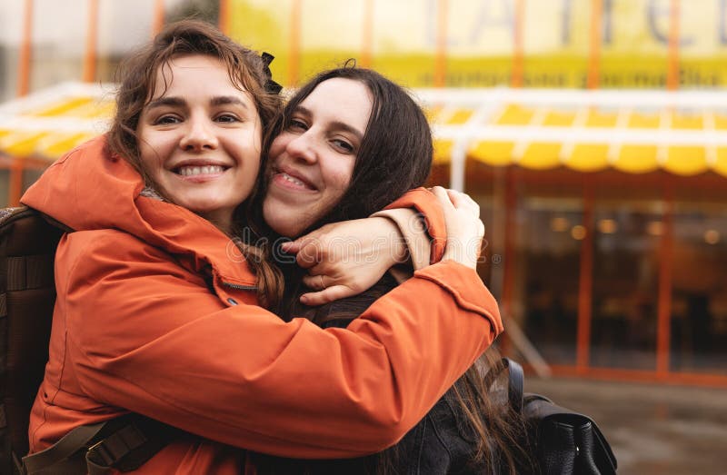 Young Friends Happily Hug Each Other when they Meet Again Stock Photo ...