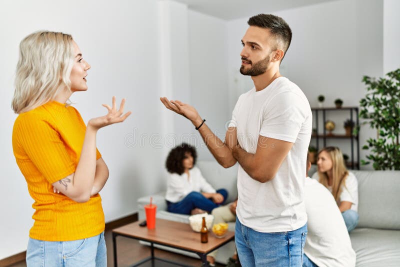Two Young Friends Standing and Speaking at Home Stock Photo - Image of ...