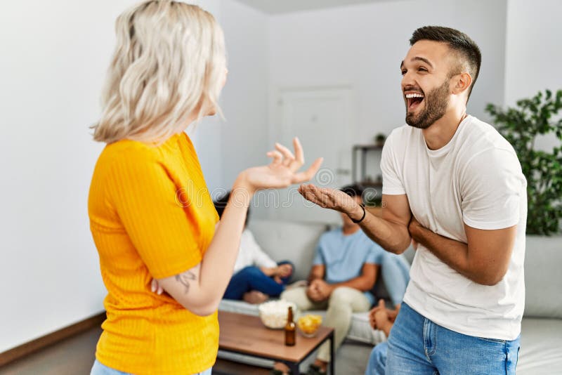 Two Young Friends Standing and Speaking at Home Stock Image - Image of ...