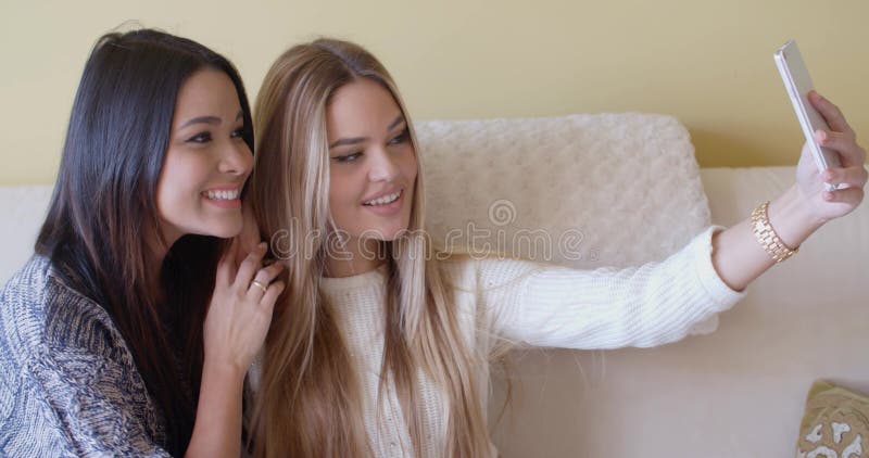 Two Young Girlfriends Taking A Selfie At Home Stock Video Video Of