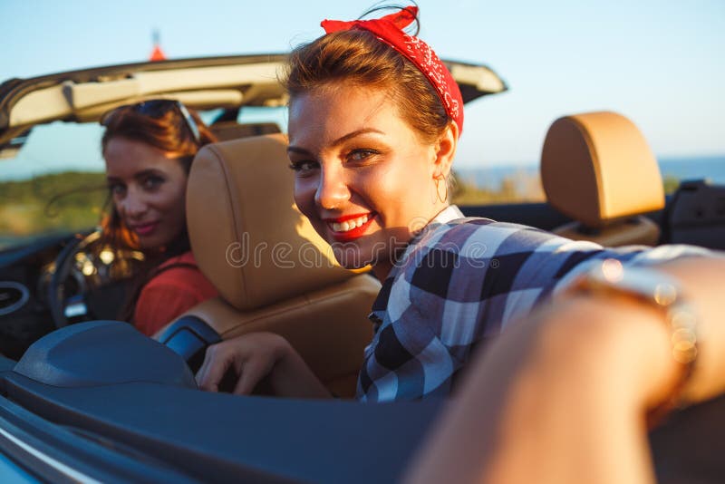 Two Young Girls Having Fun in the Cabriolet Outdoors Stock Image ...