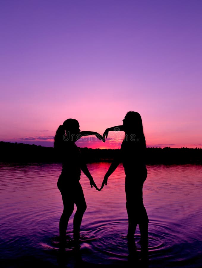 Two Young Girls Make the Shape of Heart Stock Image - Image of river ...