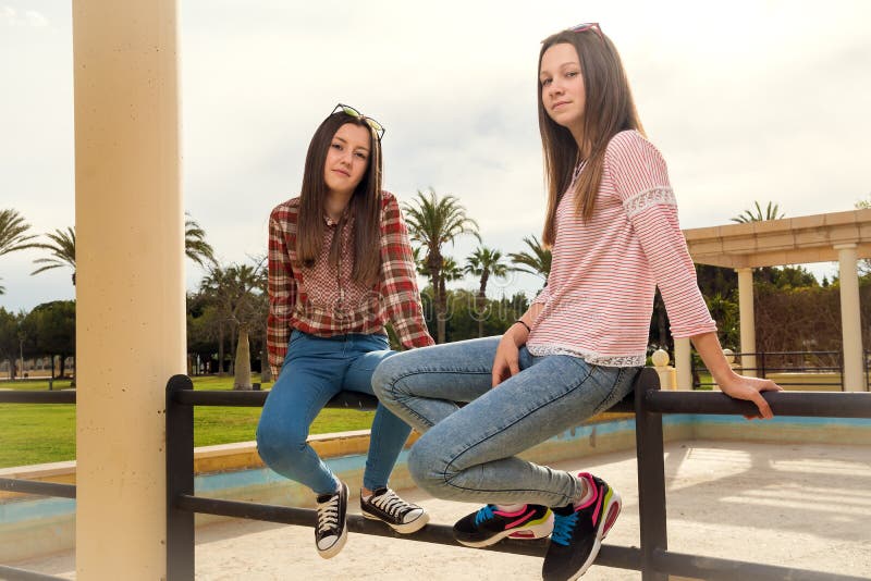 Two young girls in park stock photo. Image of teenagers - 72481368