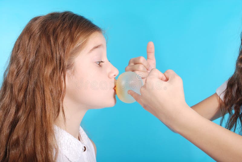 Two Young Girls Playing with Chewing Gum Stock Photo - Image of ...