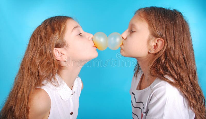 Two Young Girls Playing with Chewing Gum Stock Photo - Image of ...
