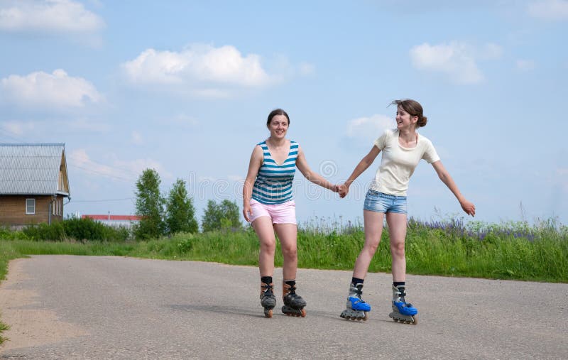 Two Young Girls on Roller Blades Stock Photo - Image of healthy, speed ...