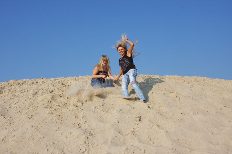 Two Young Girls on a Sand-pit Stock Image - Image of friends ...