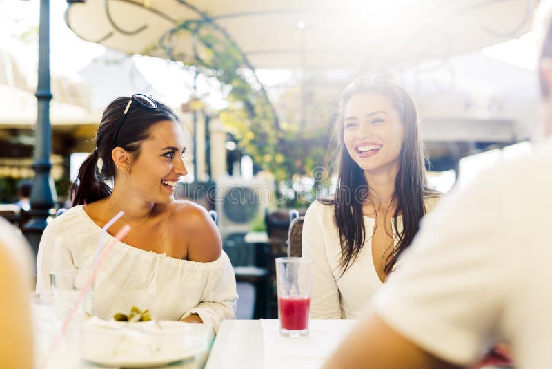 Two Young Girls Talking during Lunch Break Stock Photo - Image of ...