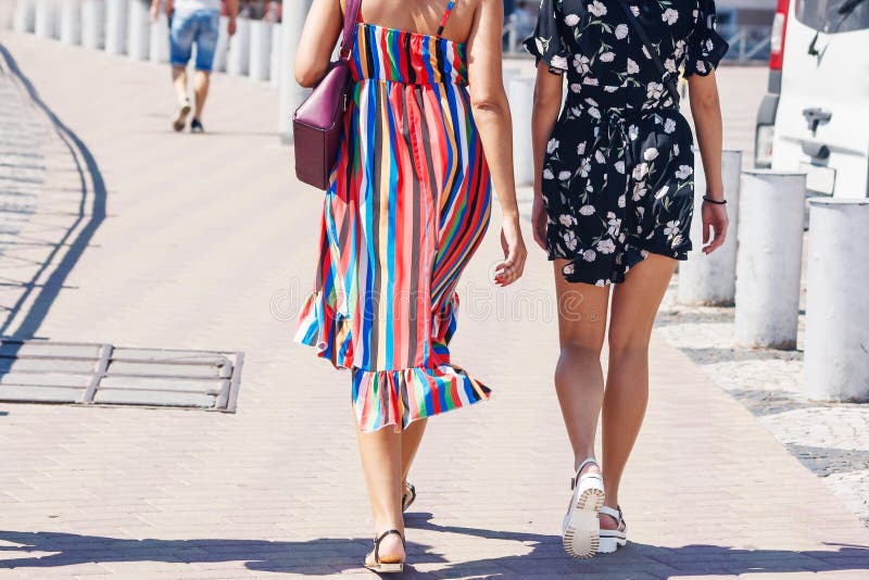 Two Young Girls Walking Down The Street Stock Image Image Of Outside