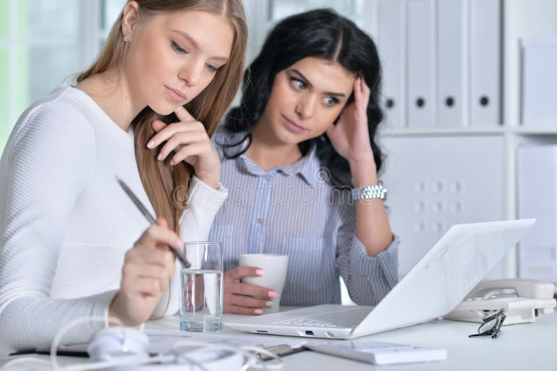 Two young girls working stock photo. Image of laptop - 85843958