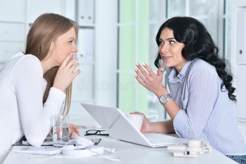 Two young girls working stock photo. Image of progress - 85844092