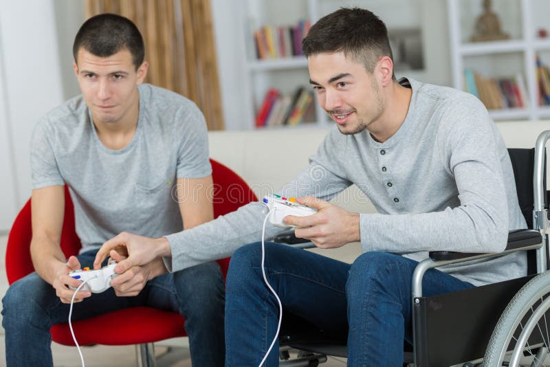 Two Young Guys Playing Video Games at Home Stock Image - Image of ...