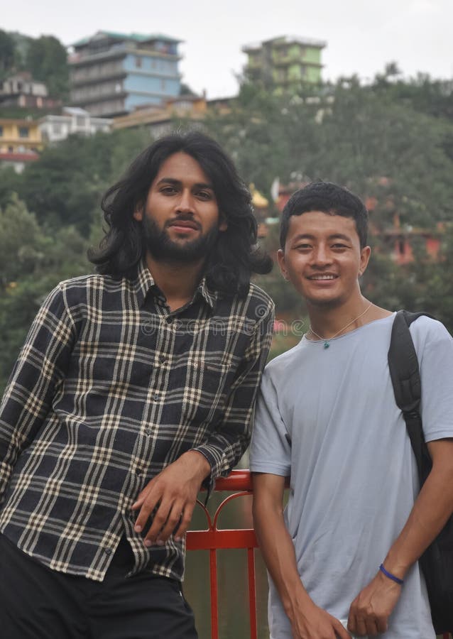Two Young Guys Posing for Photo in Outside with Looking at Camera Stock ...