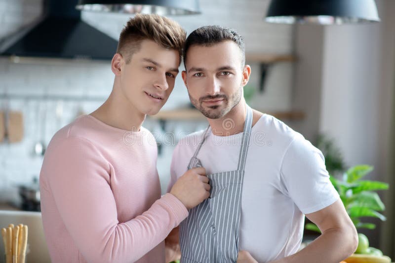 Two Young Guys Standing Close Together in a Room. Stock Photo - Image ... Two Young Guys Standing Close Together in a Room. Stock Photo - Image ...