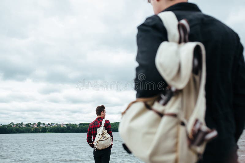 Two Young Guys Standing on a Pier Stock Photo - Image of calm, male ... Two Young Guys Standing on a Pier Stock Photo - Image of calm, male ...