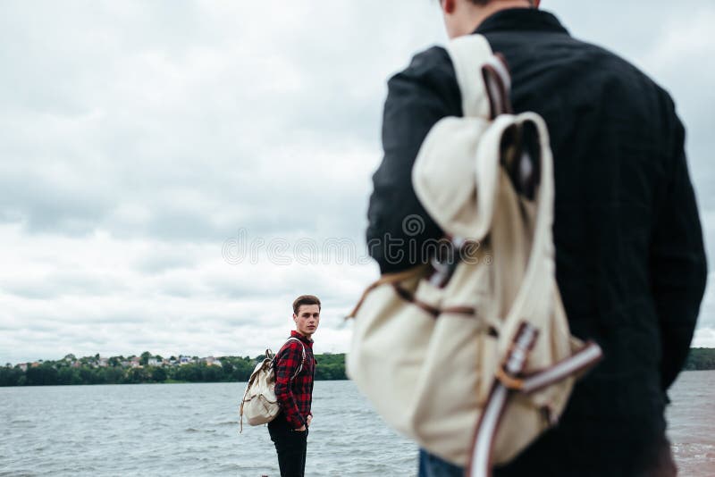 Two Young Guys Standing on a Pier Stock Photo - Image of people, hands ... Two Young Guys Standing on a Pier Stock Photo - Image of people, hands ...