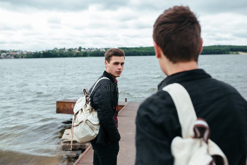 Two Young Guys Standing on a Pier Stock Photo - Image of scenic ... Two Young Guys Standing on a Pier Stock Photo - Image of scenic ...