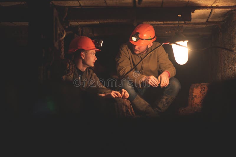 Two Young Guys in a Working Uniform and Protective Helmets Stock Photo ...