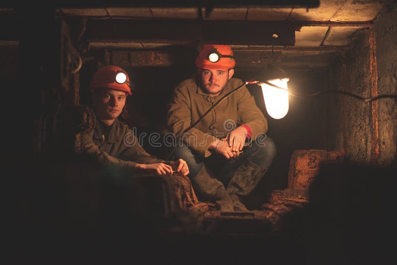 Two Young Guys in a Working Uniform and Protective Helmets Stock Image ...