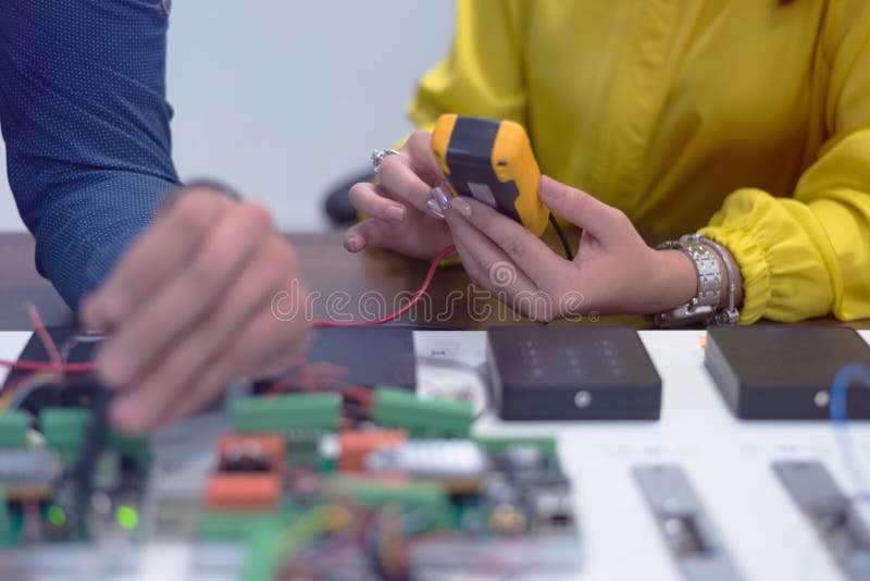 Two Young Handsome Engineers Working on Electronics Components.Tech ...