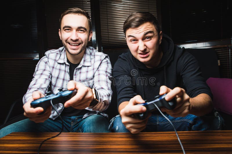 Two Young Happy Men Playing Video Games Stock Photo - Image of ...