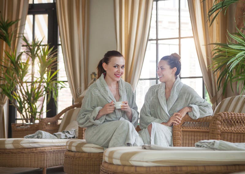 Two Young Happy Women Drinking Tea at Spa Resort Stock Image - Image of ...