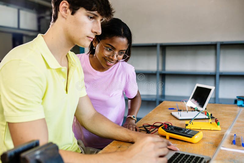 Two Young High School Students Learning Together at Technology Class ...