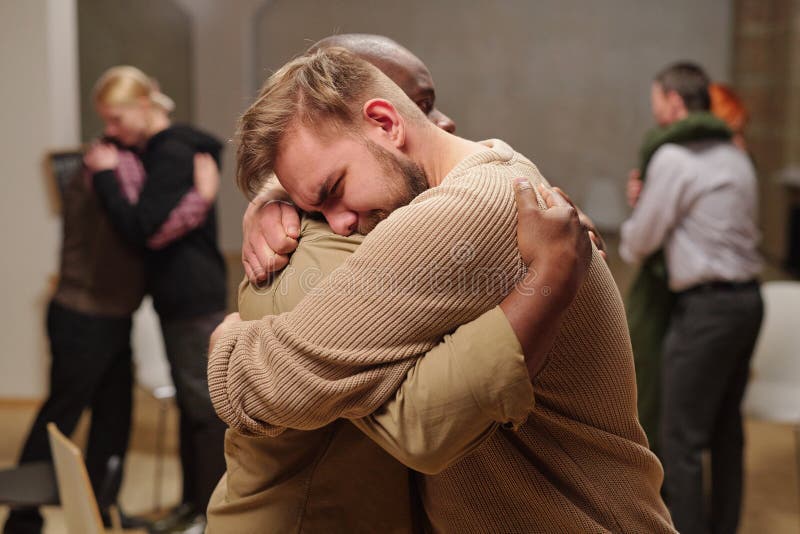Two Young Intercultural Man Embracing while Supporting One Another ...