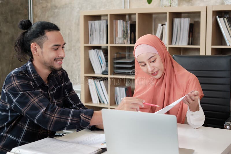 Two Young Islamic Colleagues Work in a Small Startup Office Stock Image ...