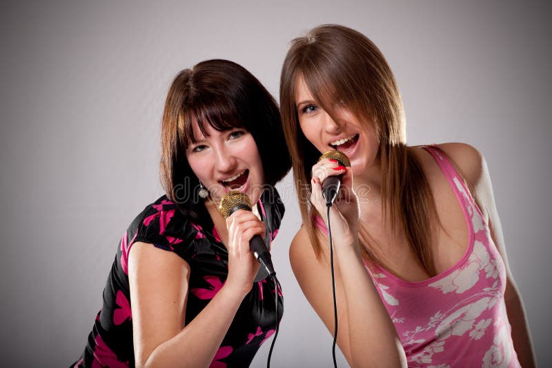 Four Beautiful Girls Singing Karaoke Stock Image - Image of frivolity ...
