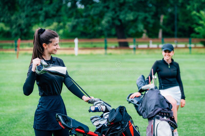 Two Young Ladies Playing Golf, Having Fun Stock Image - Image of golfer ...