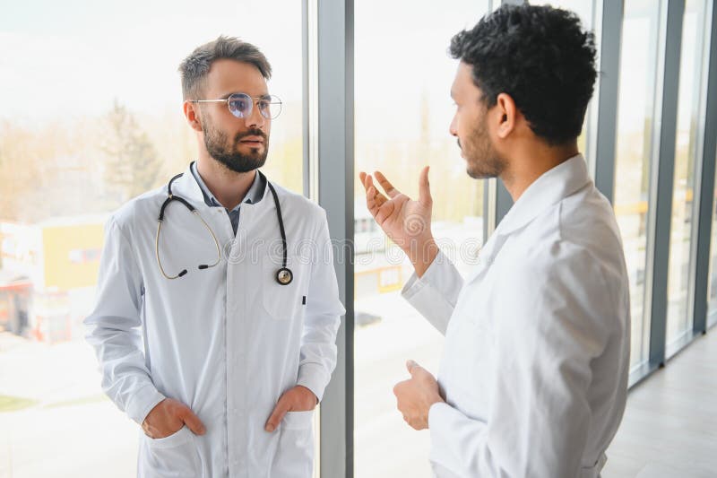 Two Young Male Doctors in the Clinic Stock Image - Image of medicare ...