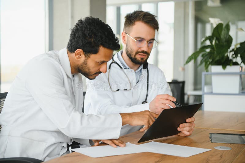 Two Young Male Doctors in the Clinic Stock Image - Image of american ...