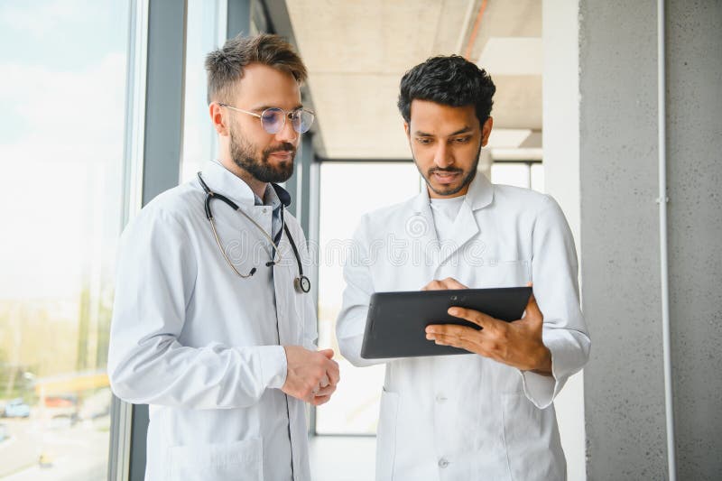 Two Young Male Doctors in the Clinic Stock Image - Image of worker ...