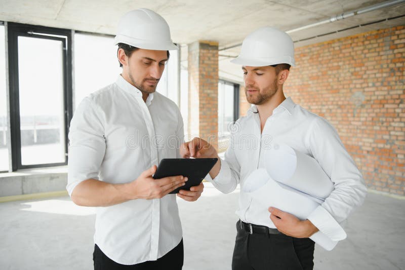 Two Young Man Architect on a Building Construction Site Stock Image ...