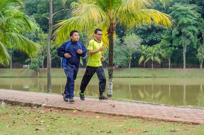 Two Young man jogging stock image. Image of outdoor, loss - 32253275