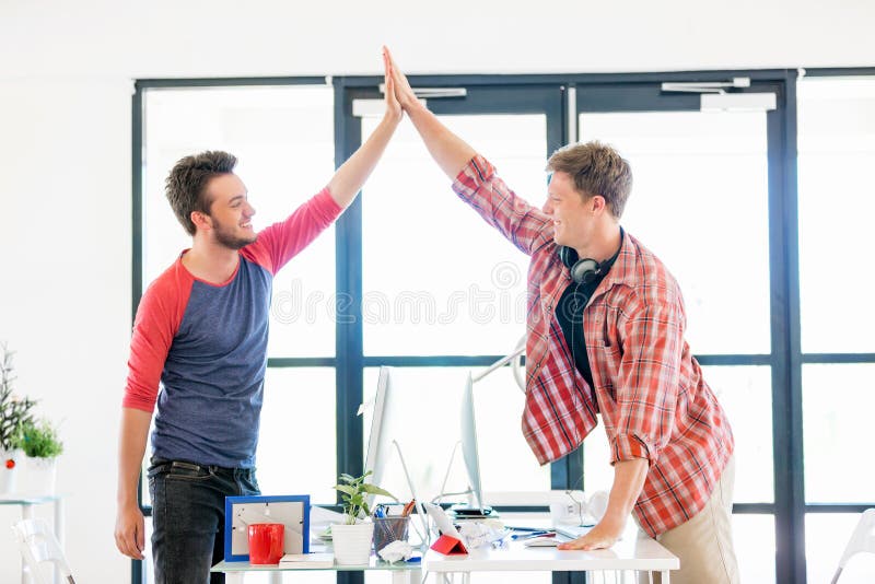 Two Young Man in Office Clapping Their Hands Stock Photo - Image of ...