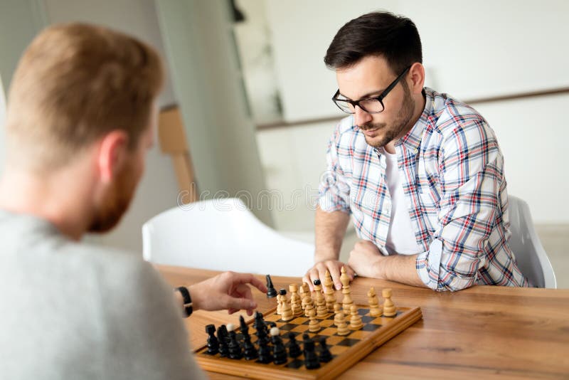 Two Young Man Playing Chess at Home Stock Image - Image of businessman ...
