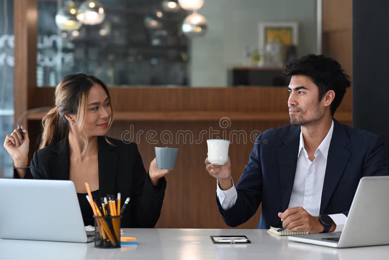 Two Managers Drinking Coffee and Chatting during Break at Bright Office ...