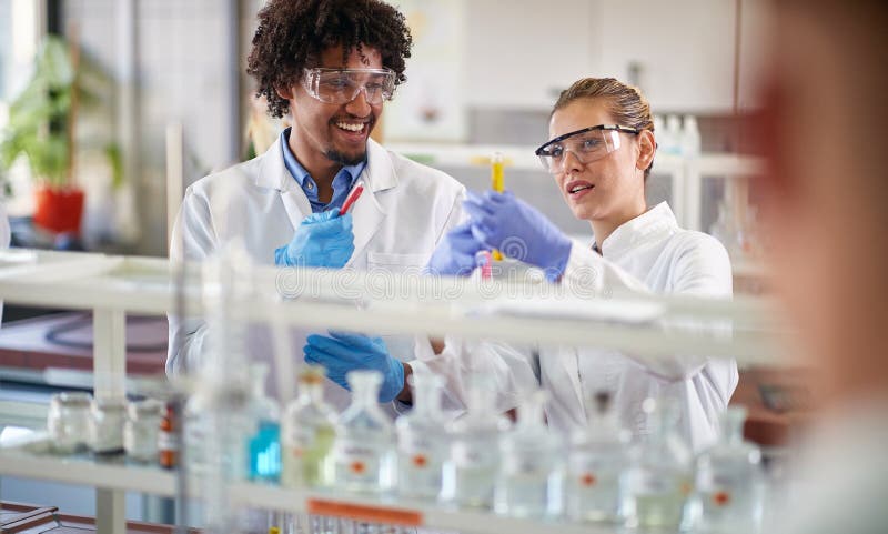 Two Young Medical Students Conducting Chemical Experiment Stock Image ...