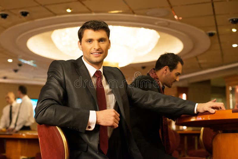 Two Young Men Behind Gambling Table Stock Image - Image of gamble, game ...