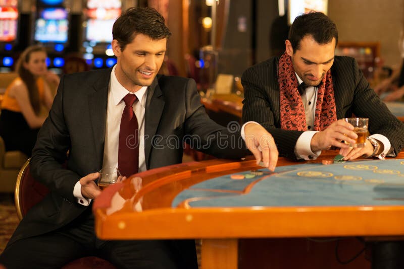 Two Young Men Behind Gambling Table Stock Image - Image of play ...
